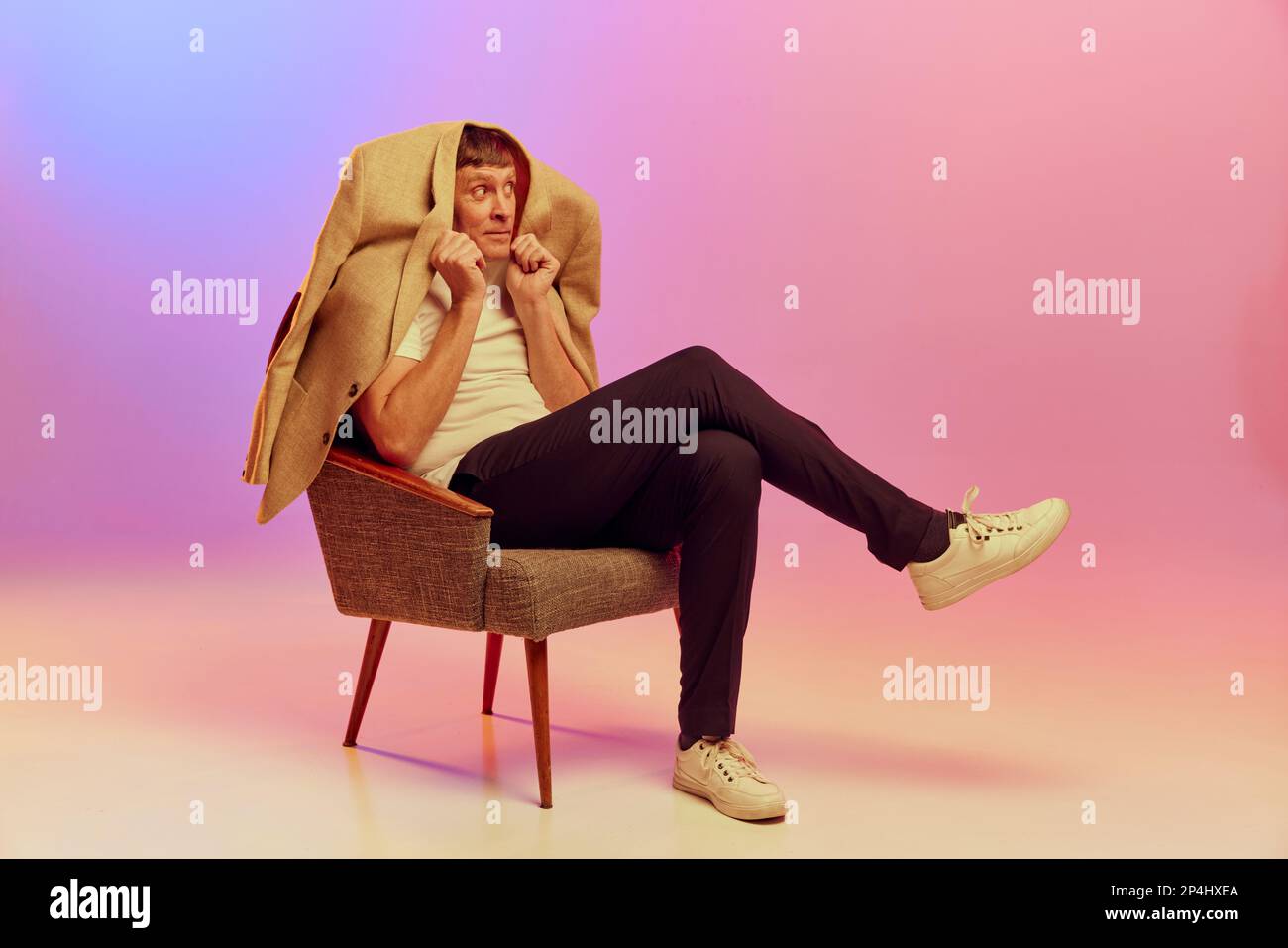 Man hiding face under jacket hi-res stock photography and images - Alamy