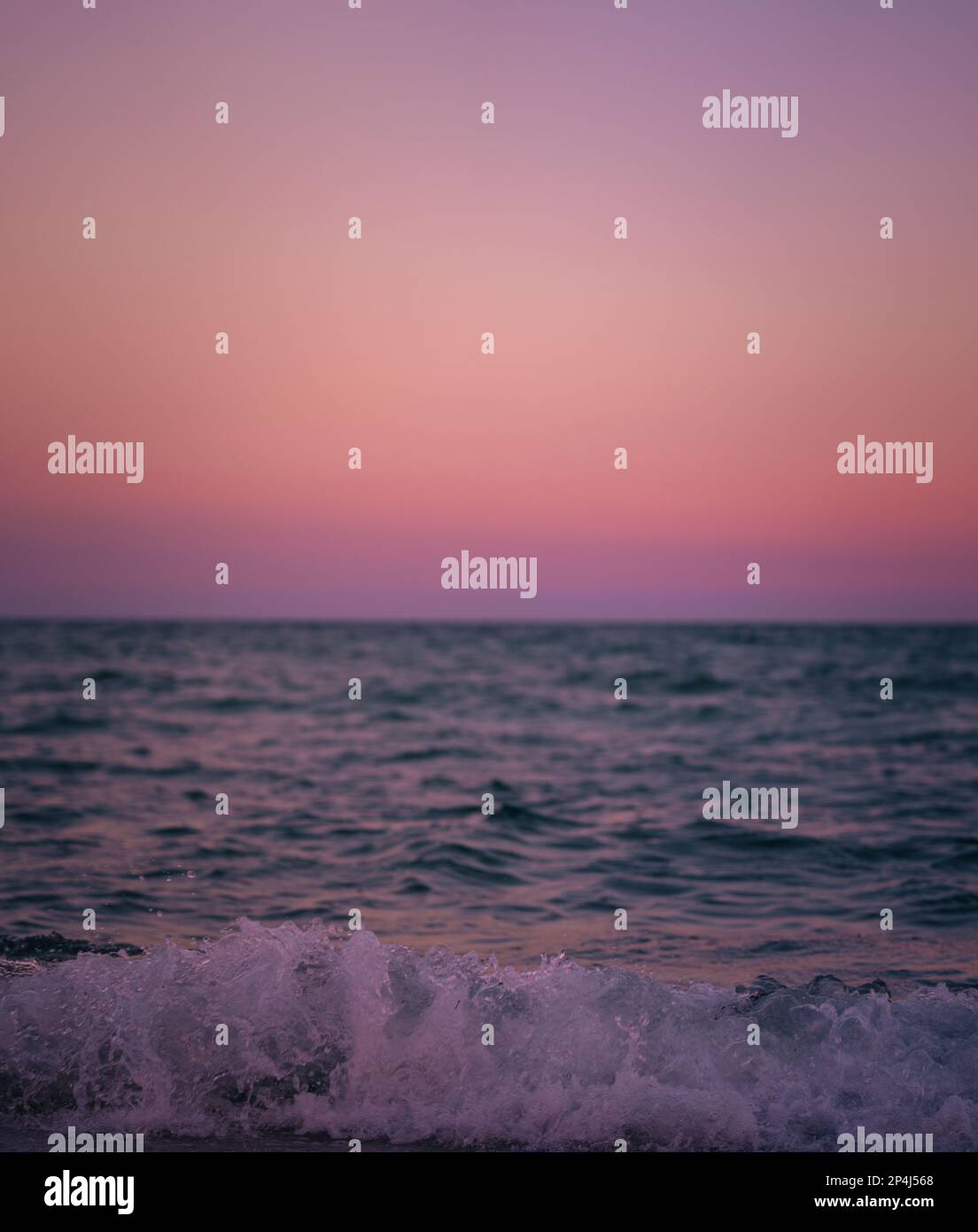 Beautiful pink sunset over ocean hi-res stock photography and images ...