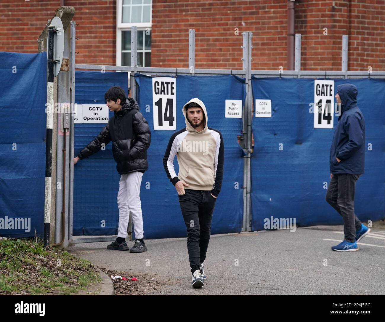 Migrants housed at Napier Barracks in Folkestone, Kent, leave through ...