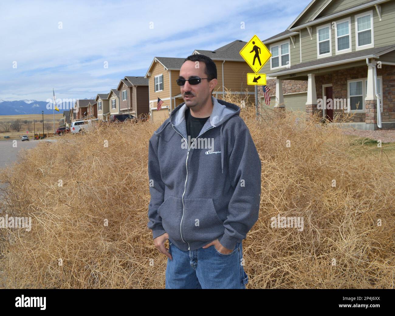 This March 21, 2014 photo shows Chris Talbott standing with a pile of ...