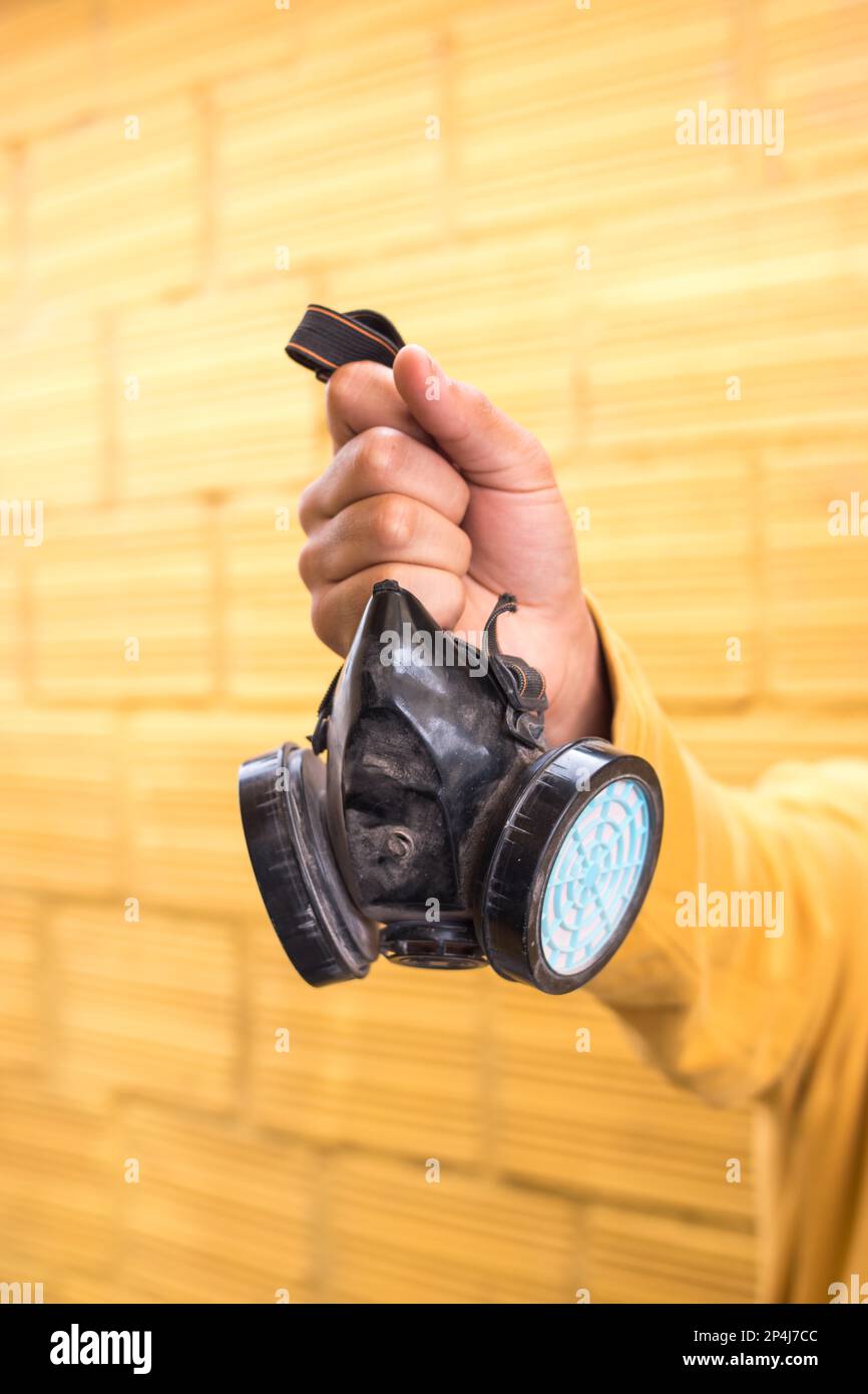 Young man taking off mask hi-res stock photography and images - Alamy