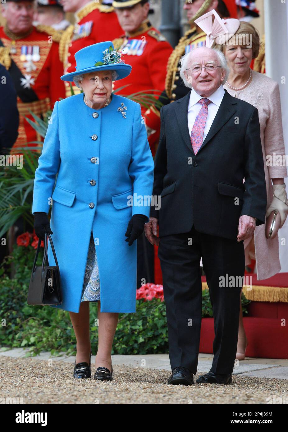 Britain's Queen Elizabeth II walks with President of Ireland Michael D ...