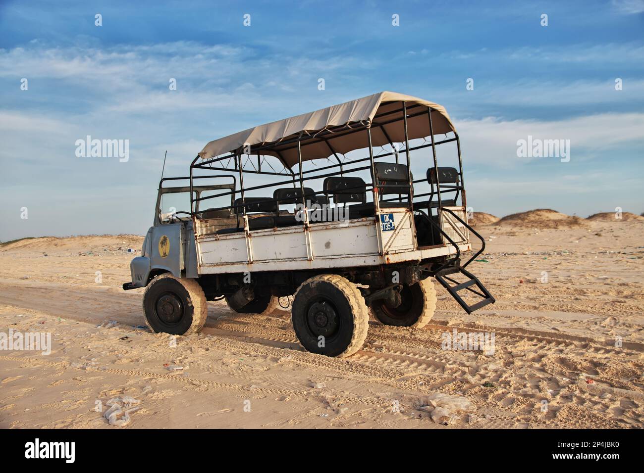 Public bus in dunes close Lake rose, The finish of Paris Dakar rally ...