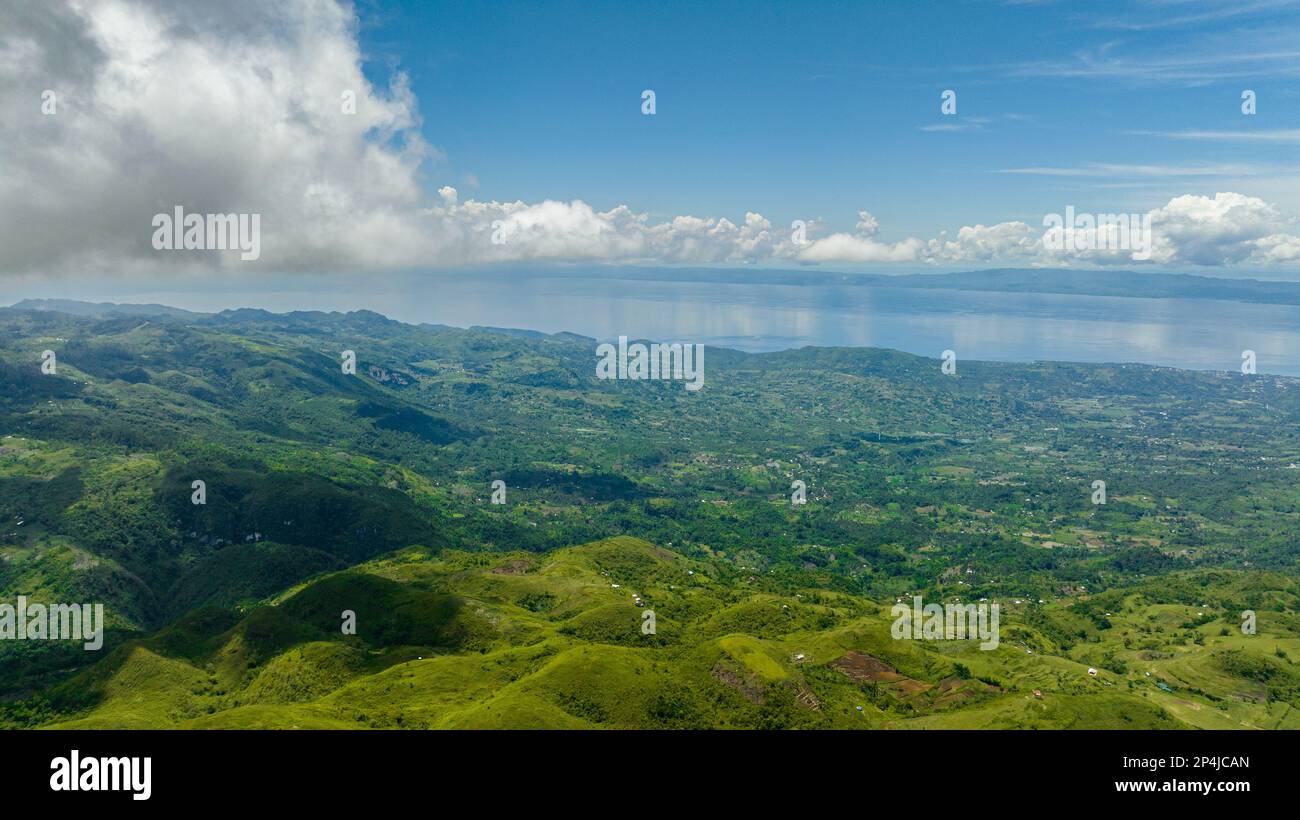 Mountains to the sea and the island of Cebu view from above. Negros ...