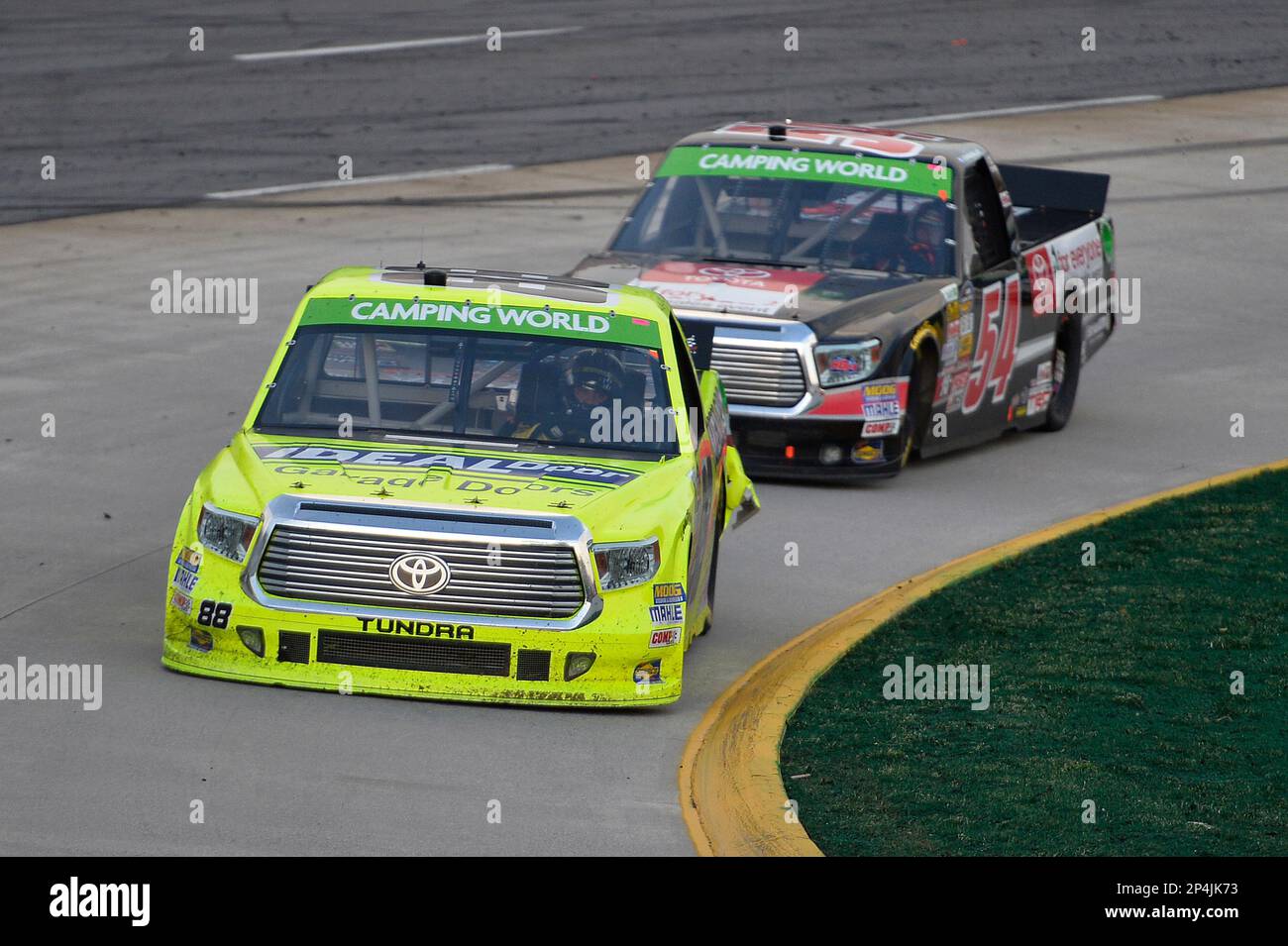 Matt Crafton leads Darrell Wallace Jr during the NASCAR Camping World ...