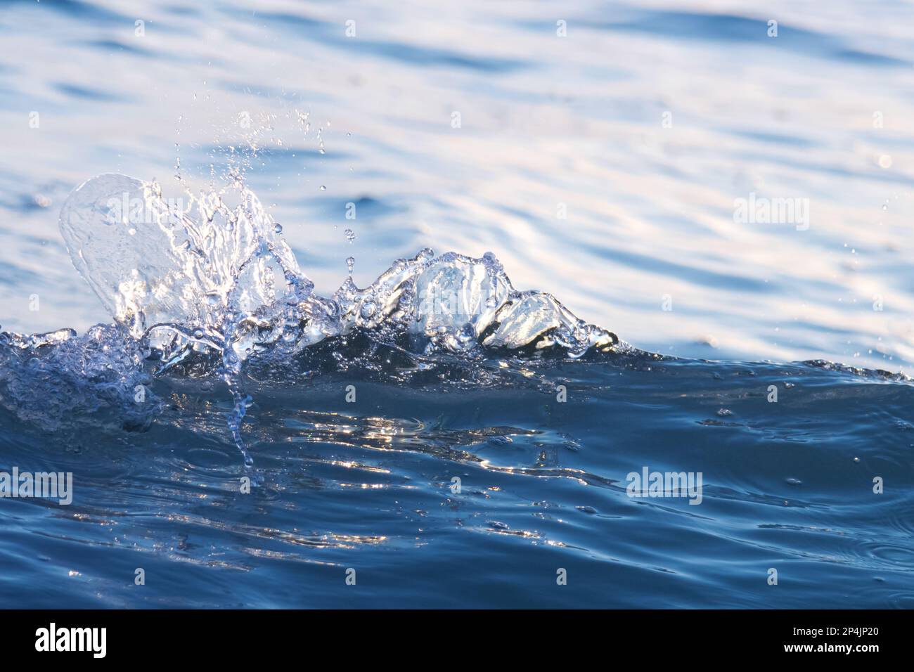 Blue ocean wave splashing on the beach. Sea wave Stock Photo - Alamy