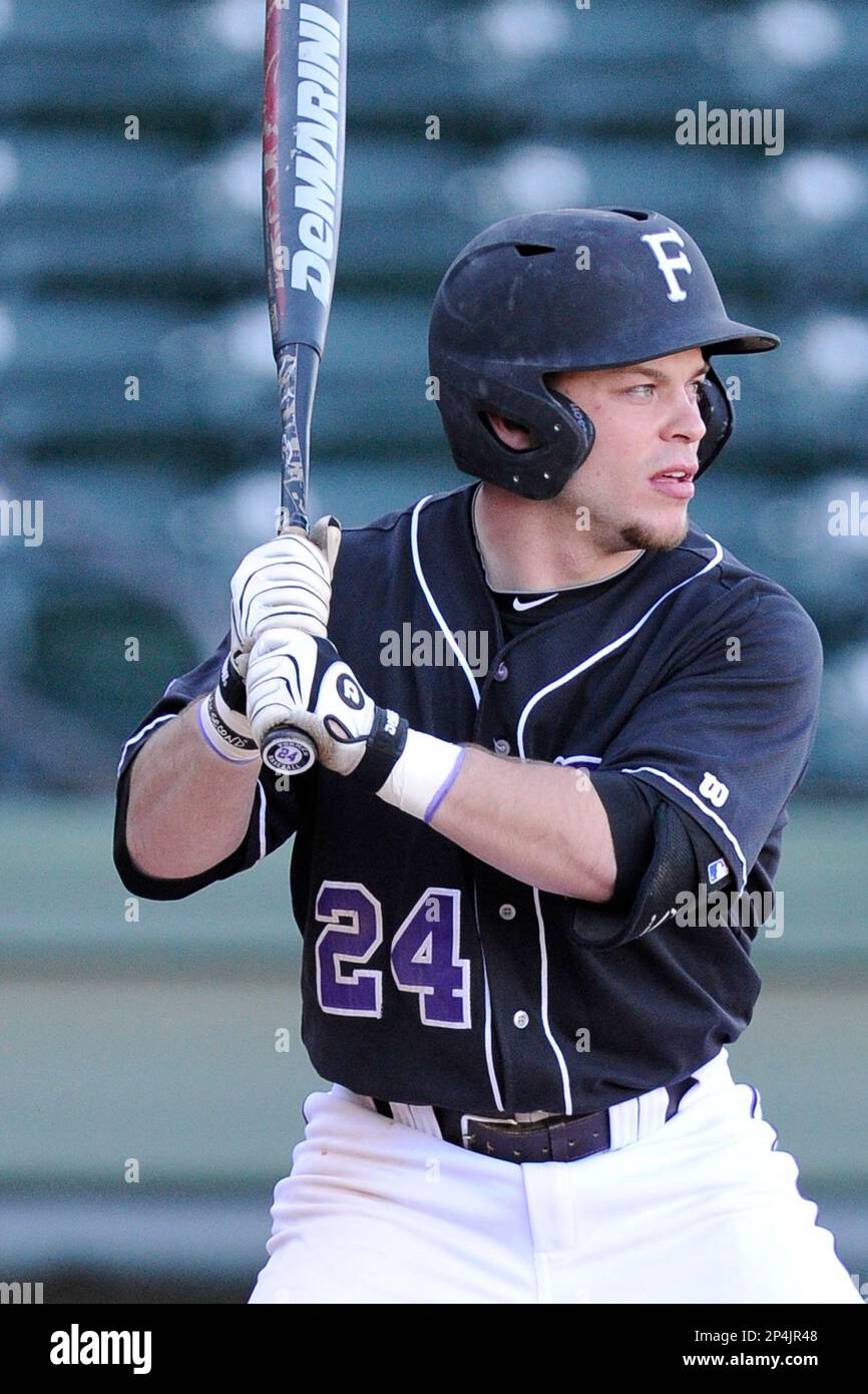 Right fielder Heath Burton (24) of the Furman University Paladins hits ...