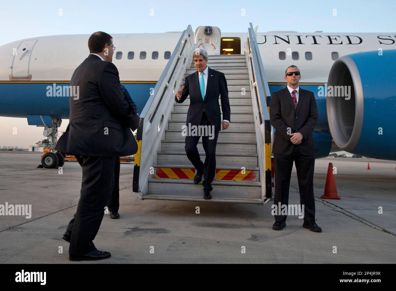 U.S. Secretary of State John Kerry reaches out to shake hands with U.S ...