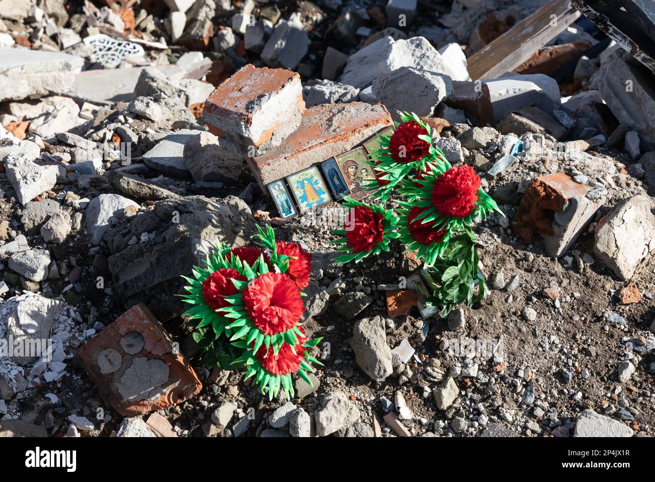 Icons and artificial flowers in memory of the city's dead. Memorial ...