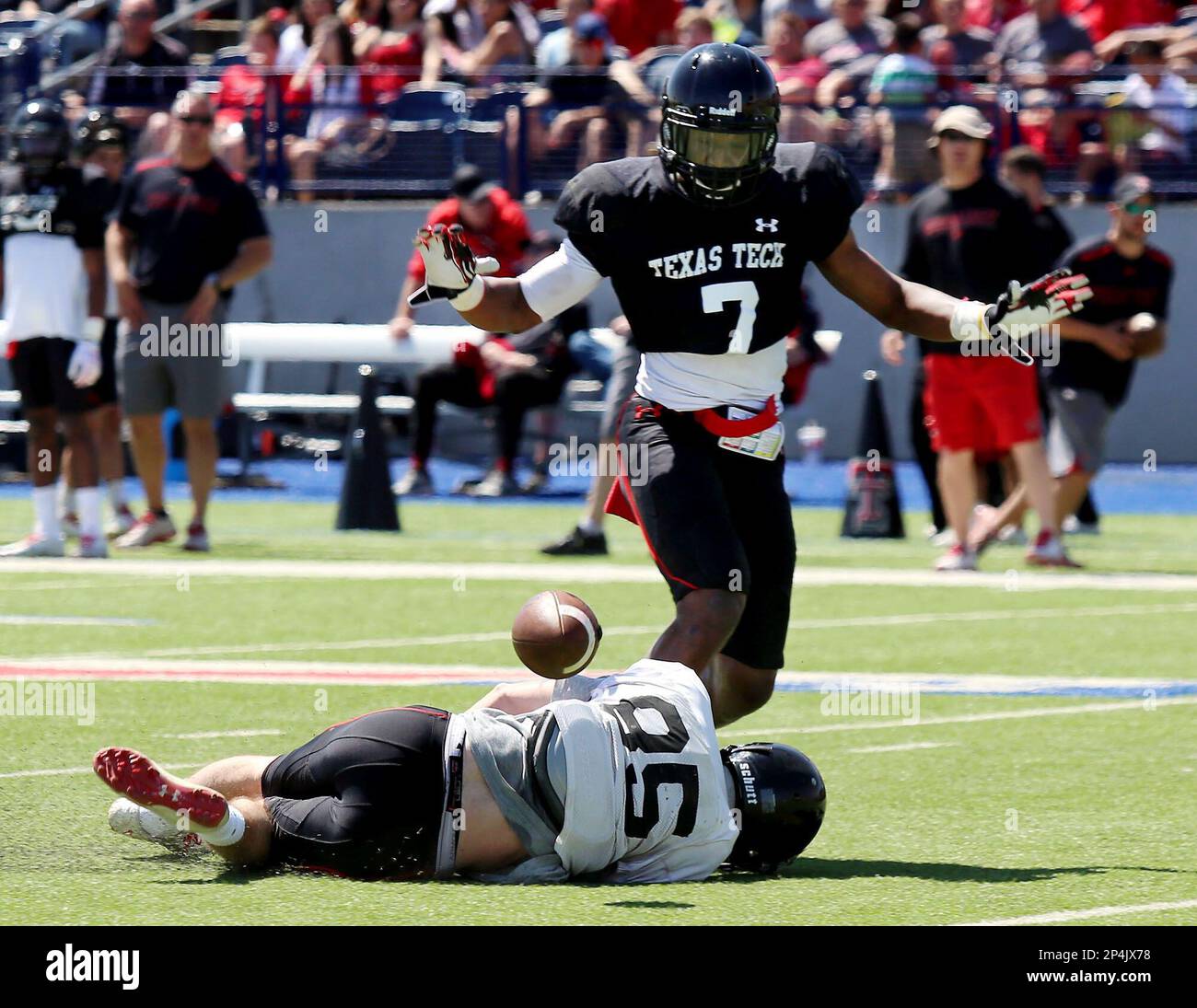 Texas Tech safety Josh Keys motions over wide receiver Jordan Davis ...