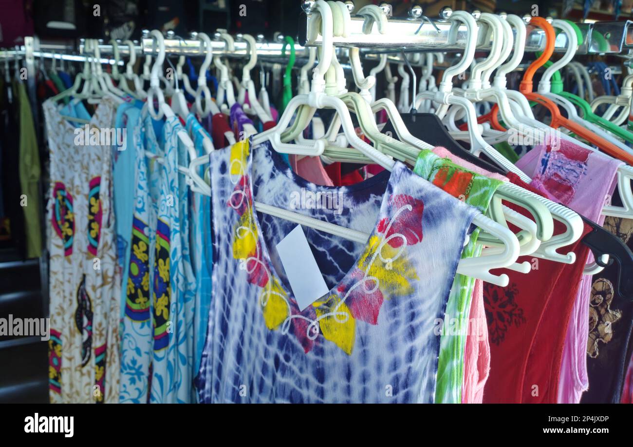 Clothes on hangers, street store Stock Photo - Alamy