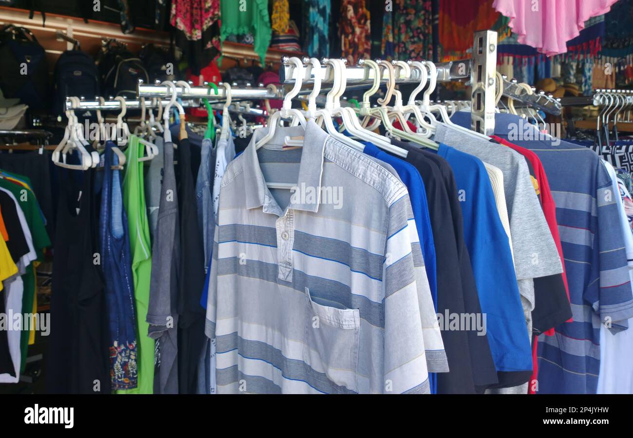 Clothes on hangers, street store Stock Photo - Alamy