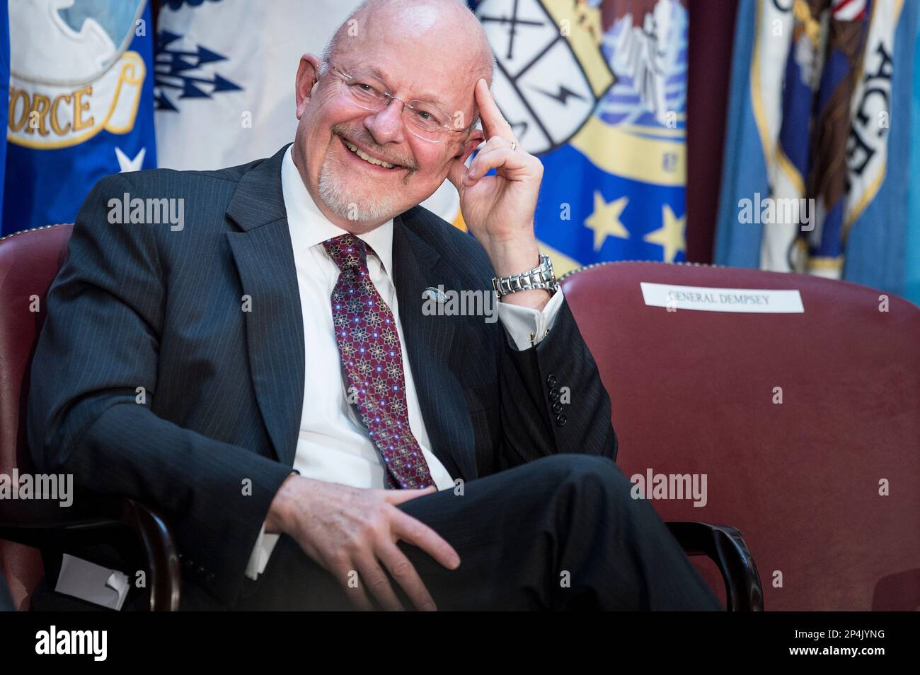 Director of National Intelligence James R. Clapper listens during a ...