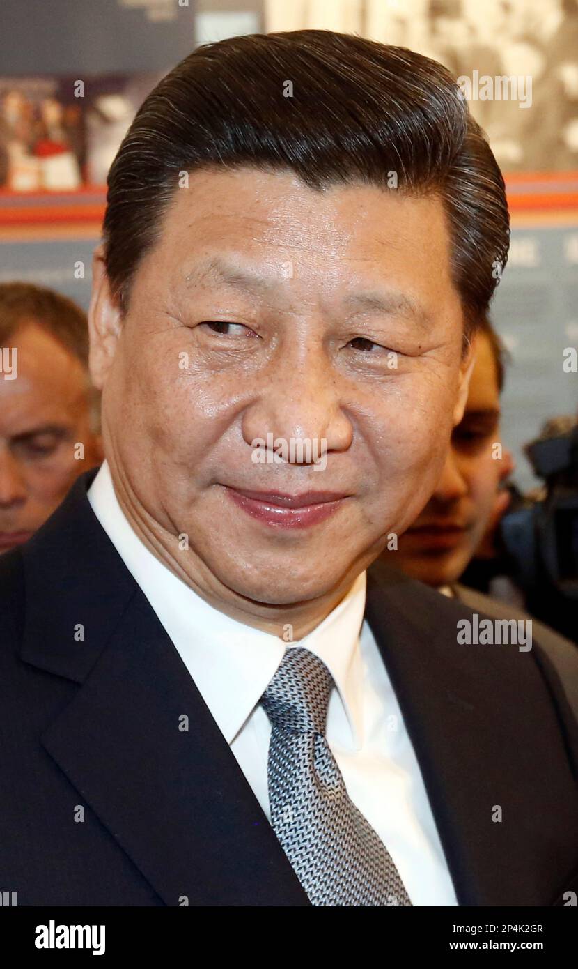 Chinese President Xi Jinping smiles as he visits an exhibition at the ...