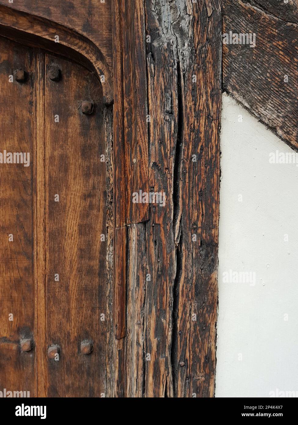 Detail of a traditional studded wood panelled door Stock Photo - Alamy