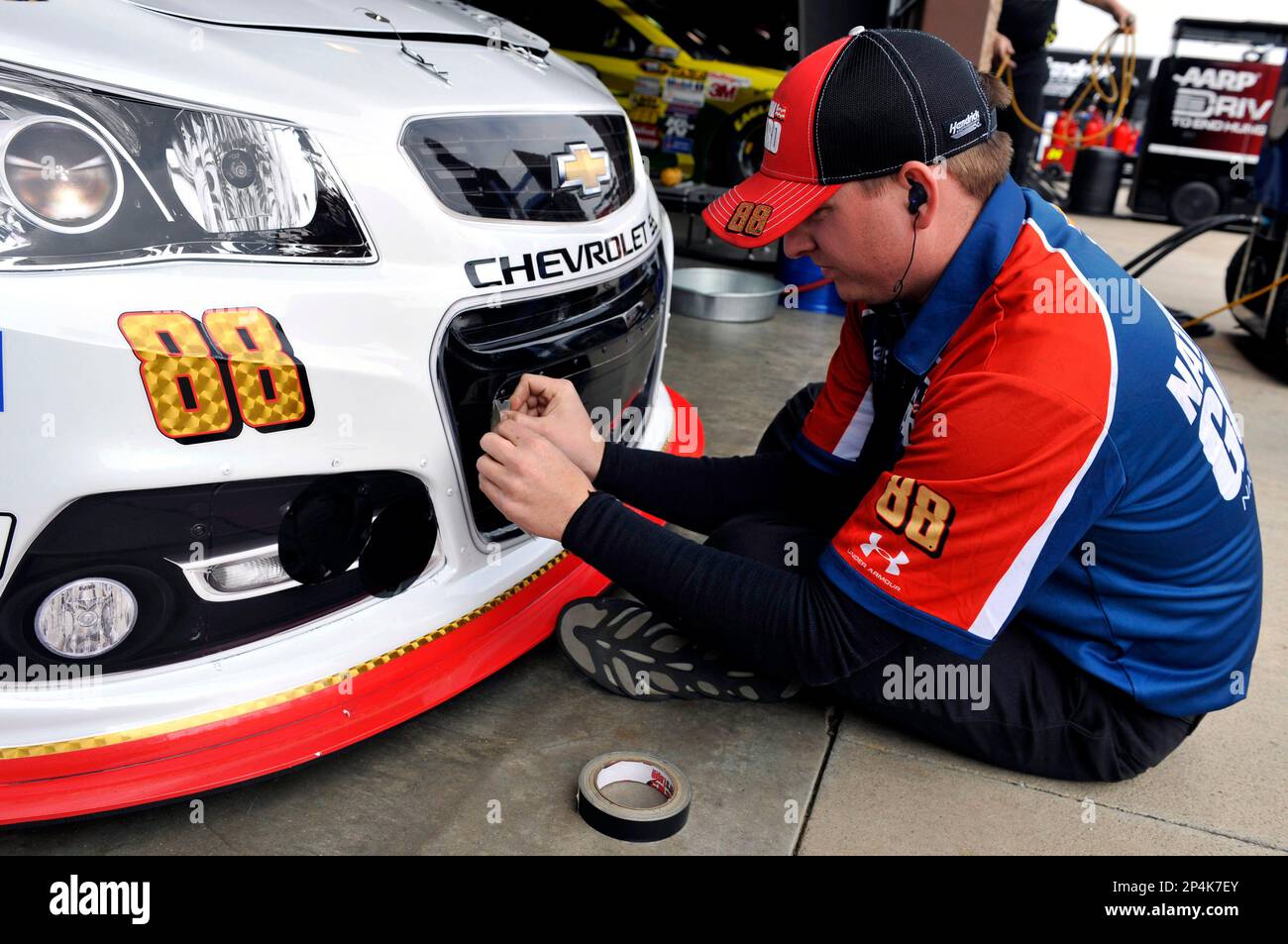Jay Nolan works on Dale Earnhardt Jr's car during practice for the ...