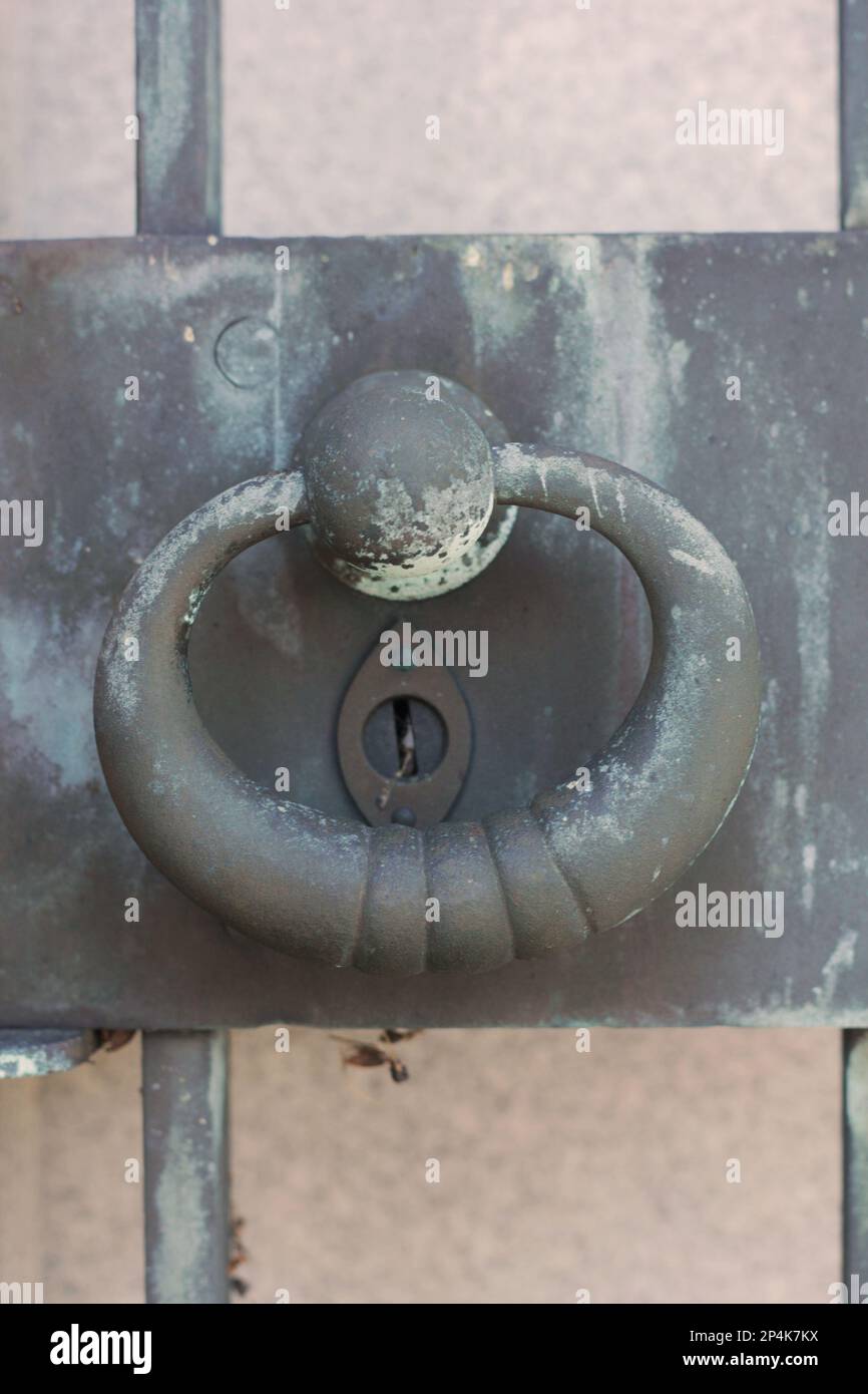 A keyhole and door pull handle of a medieval metal gate Stock Photo - Alamy