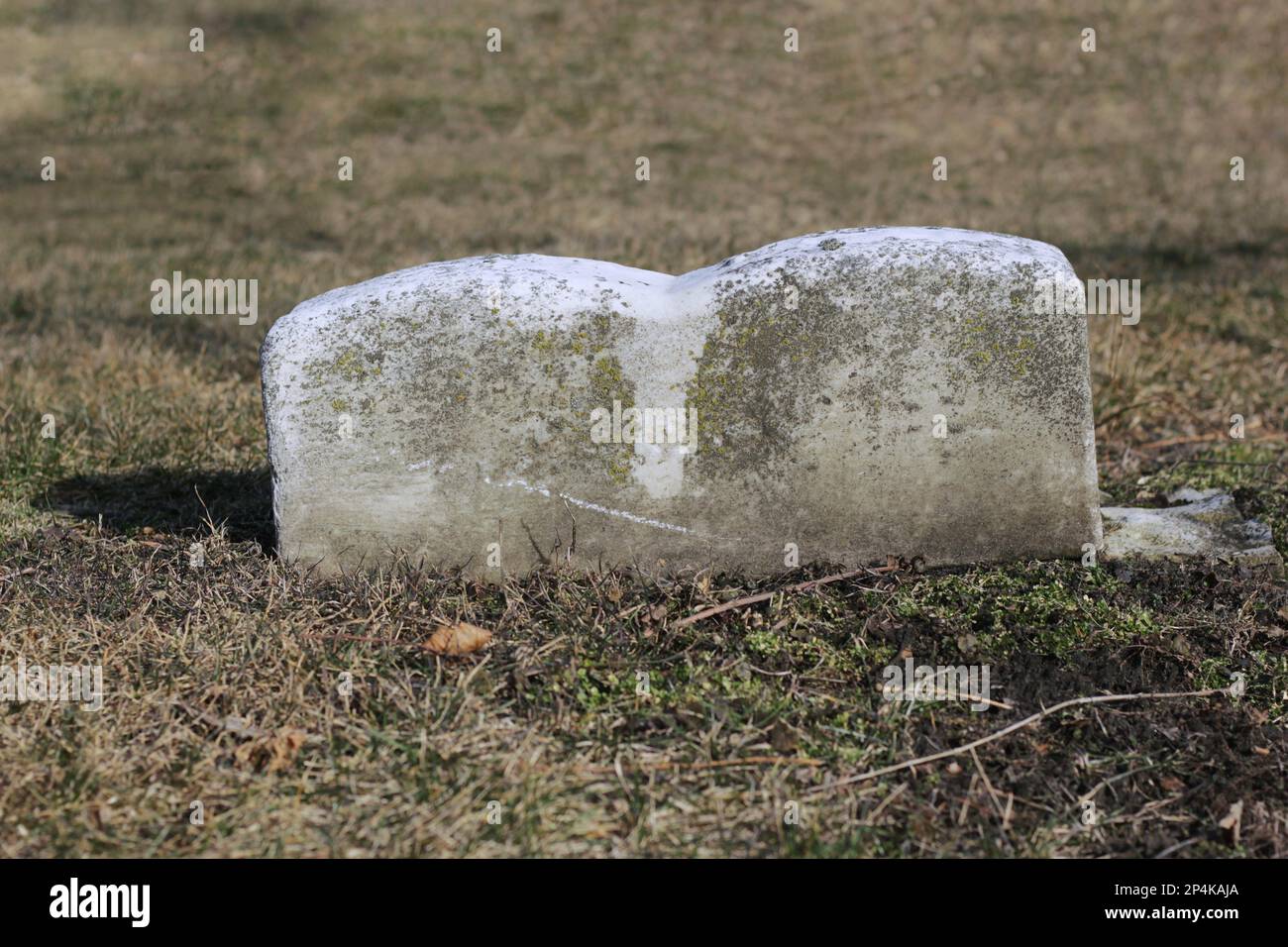 A twin tombstone with a worn and weathered blank epitaph with room for ...
