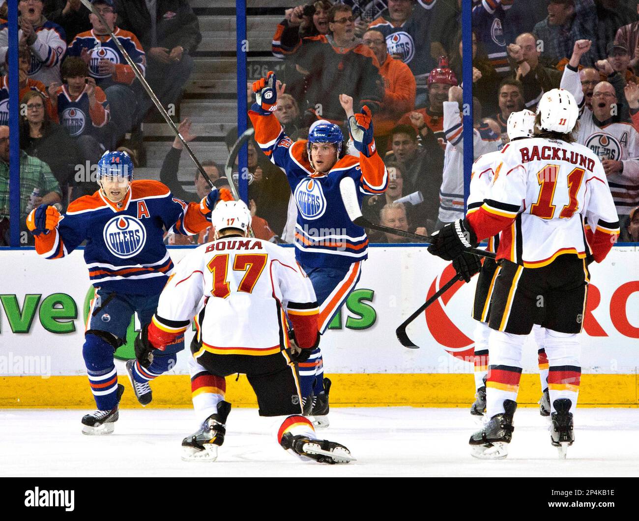 Calgary Flames' Lance Bouma (17), Mikael Backlund (11) and TJ Brodie ...