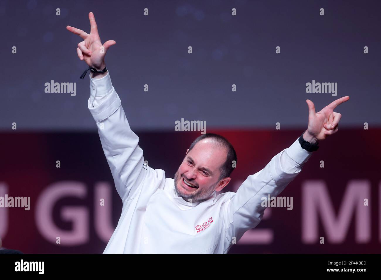 French chef Alexandre Couillon shows three fingers after he was awarded ...