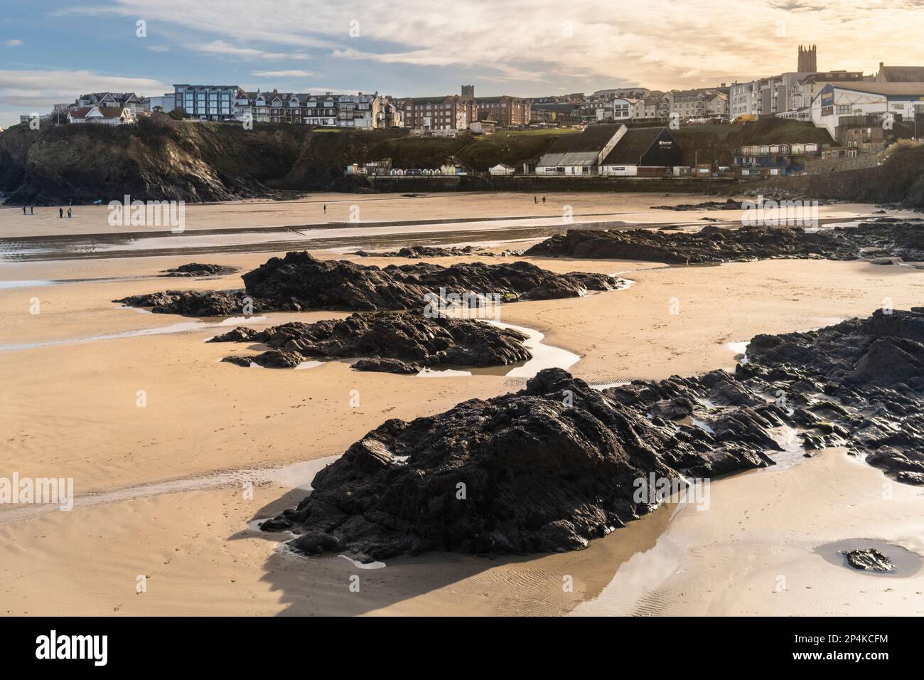 Late afternoon light over Towan Beach at low tide in Newquay in ...