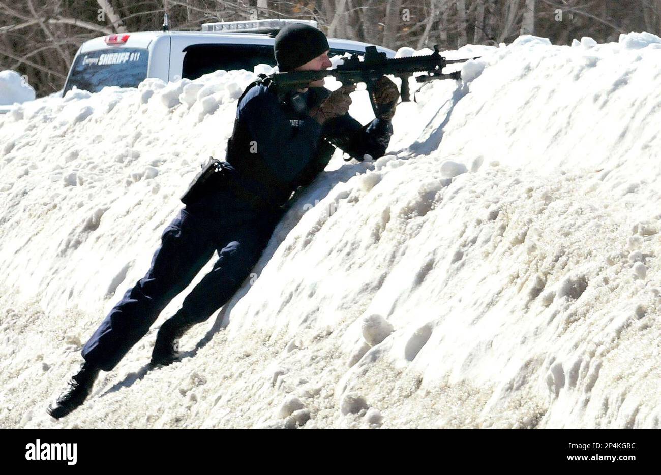 In this Tuesday, March 18, 2014 photo, trooper Scott Duff trains his ...