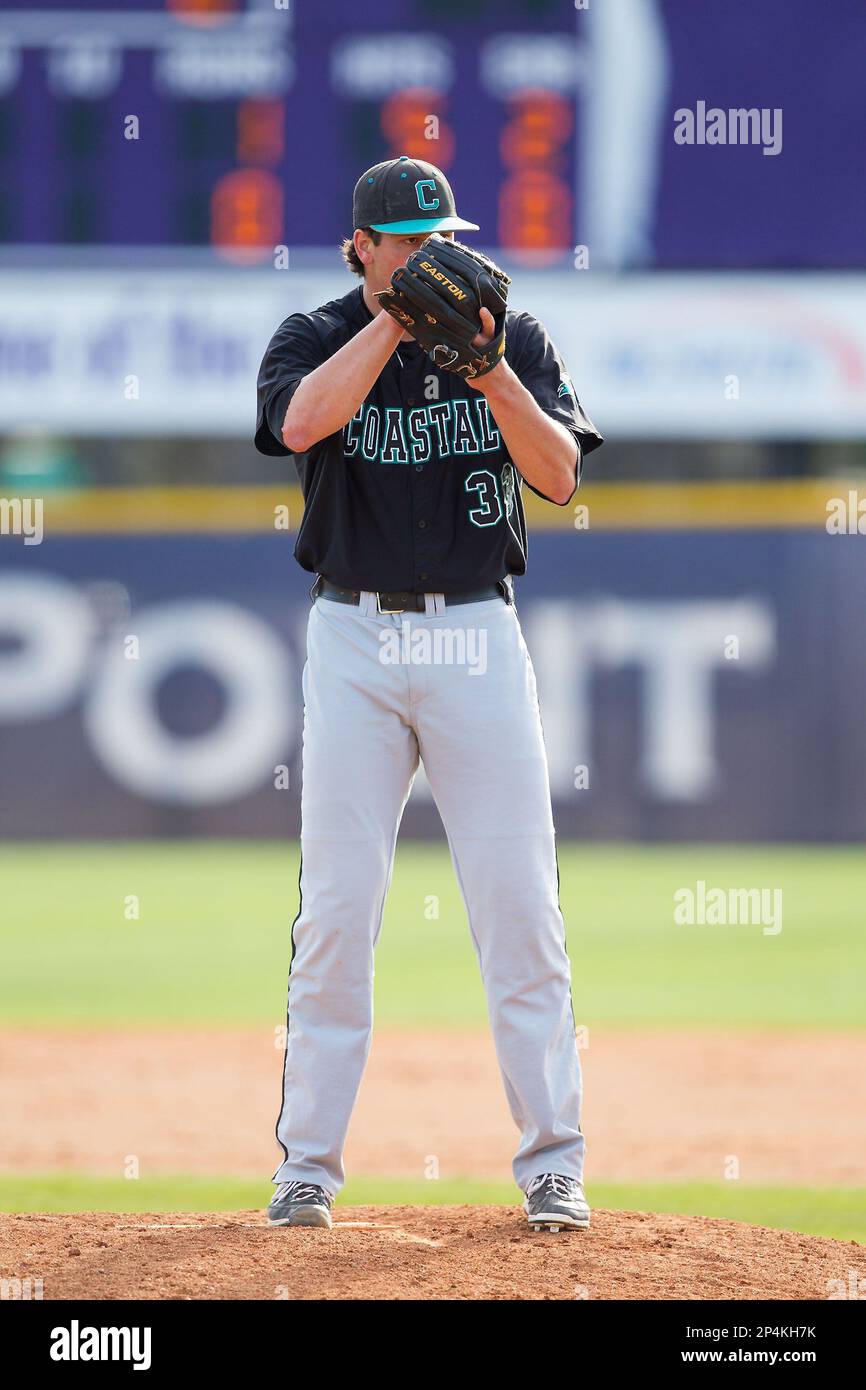 Coastal Carolina Chanticleers relief pitcher Tyler Poole (33) looks to ...