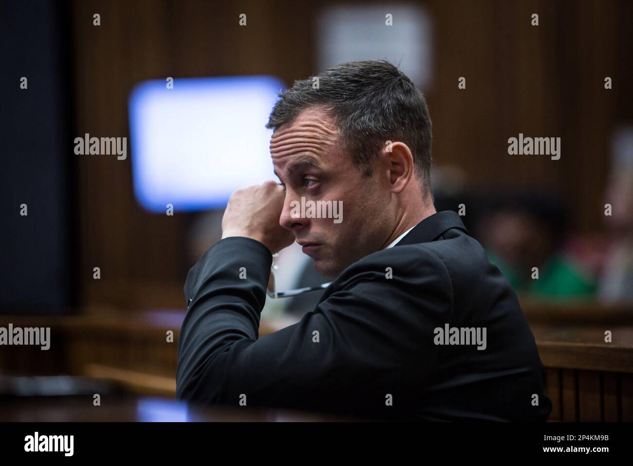 Oscar Pistorius, wipes his eye during crime scene photographs as he ...