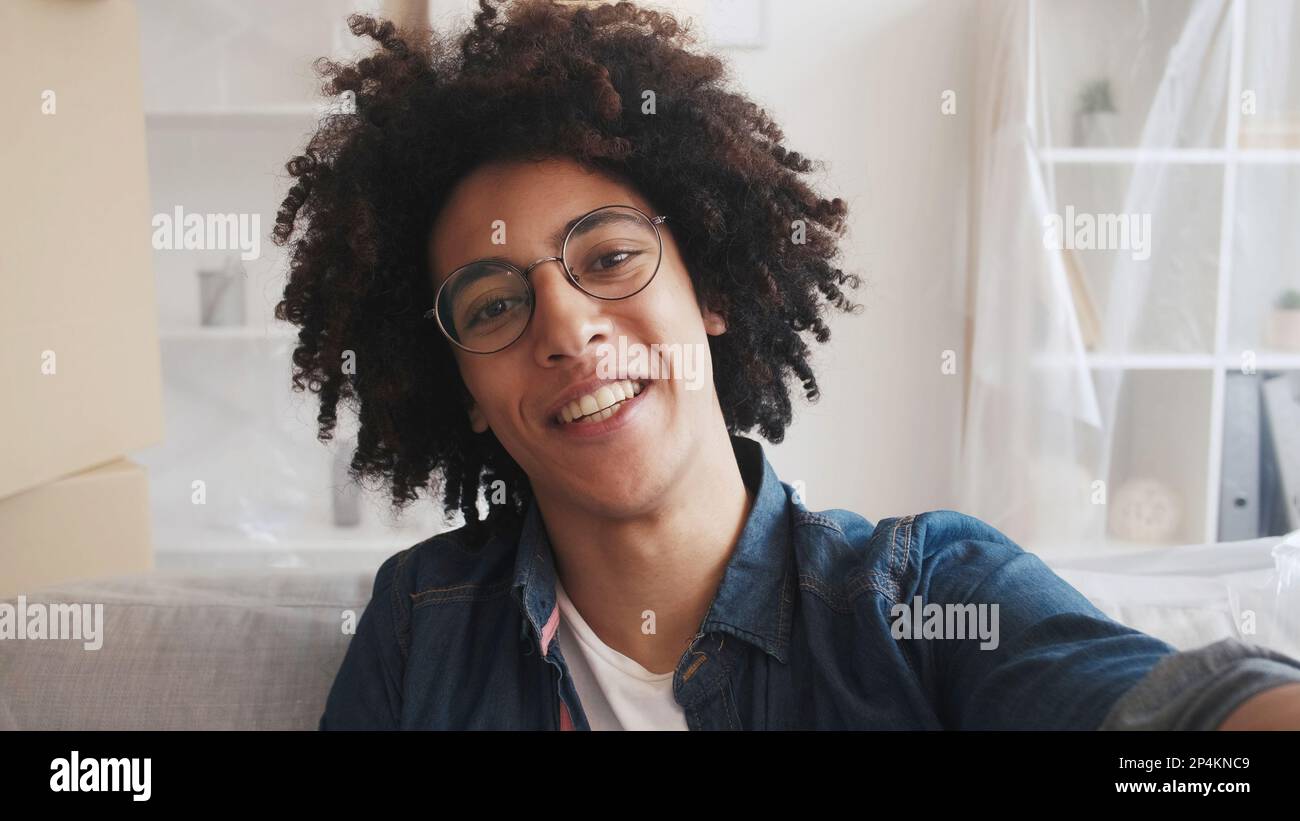 Home selfie moving day portrait smiling guy face Stock Photo - Alamy