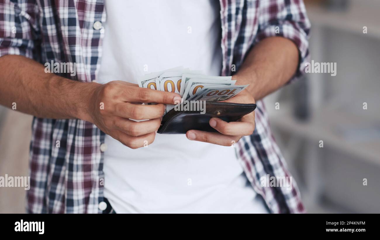 Unrecognizable rich man counting money hi-res stock photography and ...