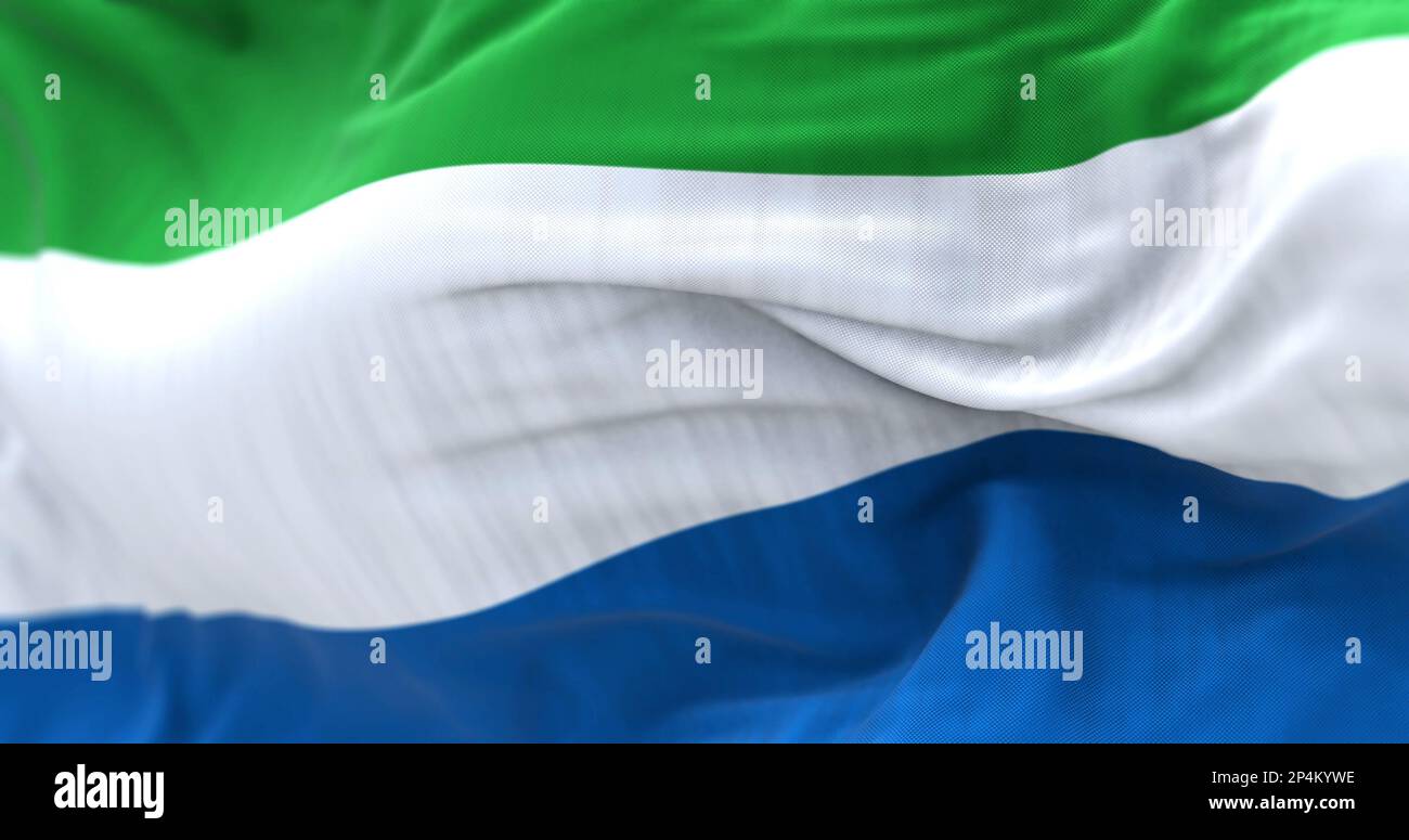 Detail of the Sierra Leone national flag waving in the wind. Tricolor ...