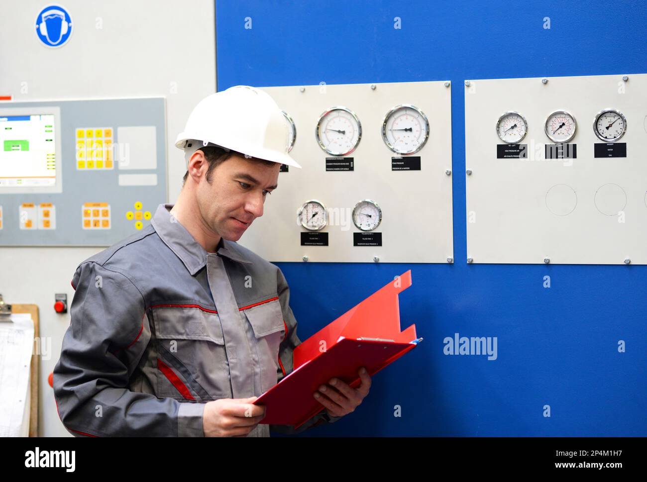 industrial workers inspect the technology of a plant for function ...