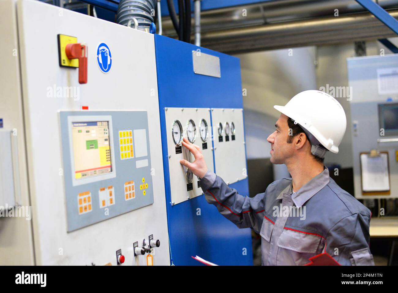 industrial workers inspect the technology of a plant for function ...