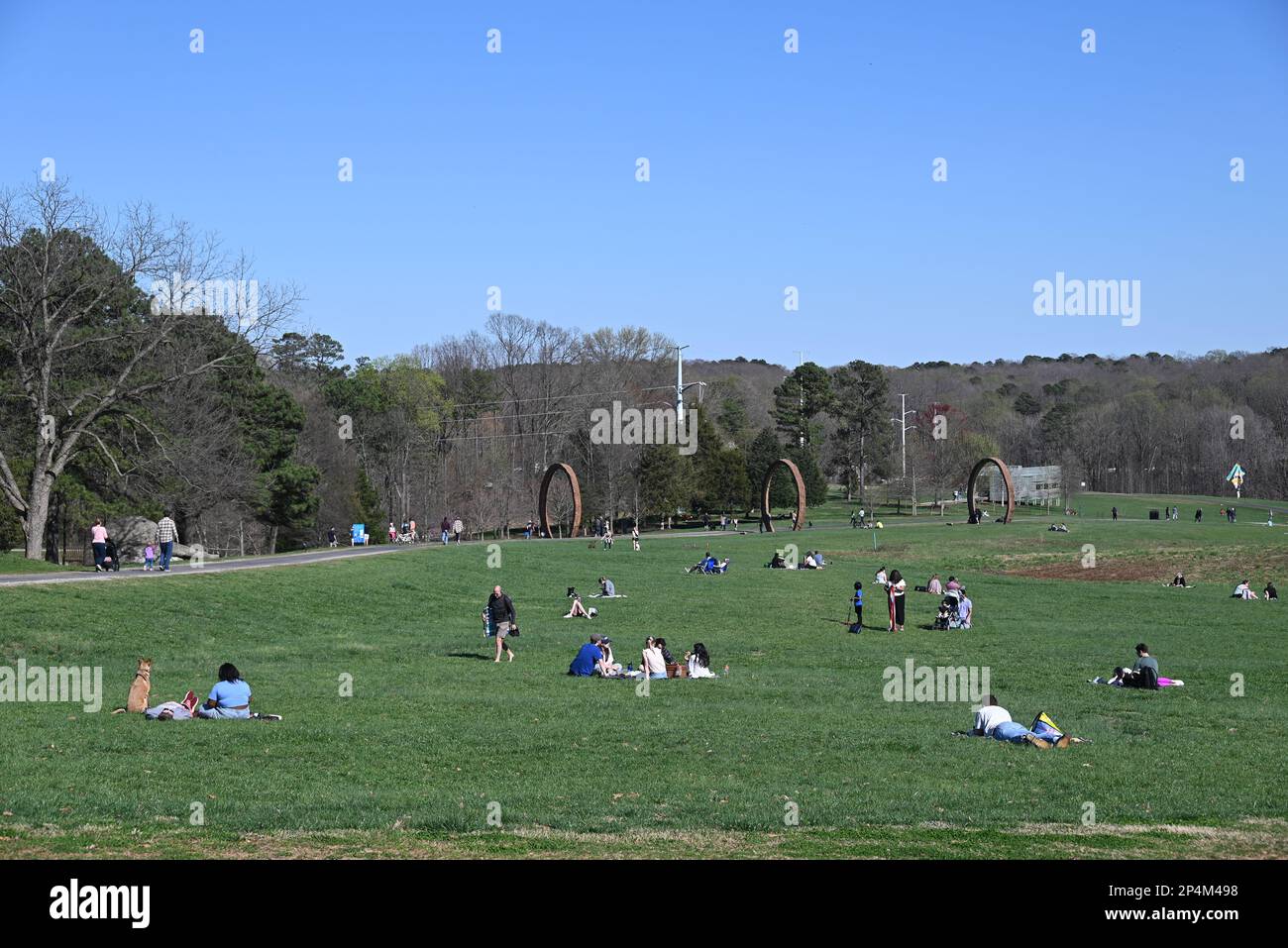 People sitting out on the lawn enjoying a warm spring day at the NCMA ...
