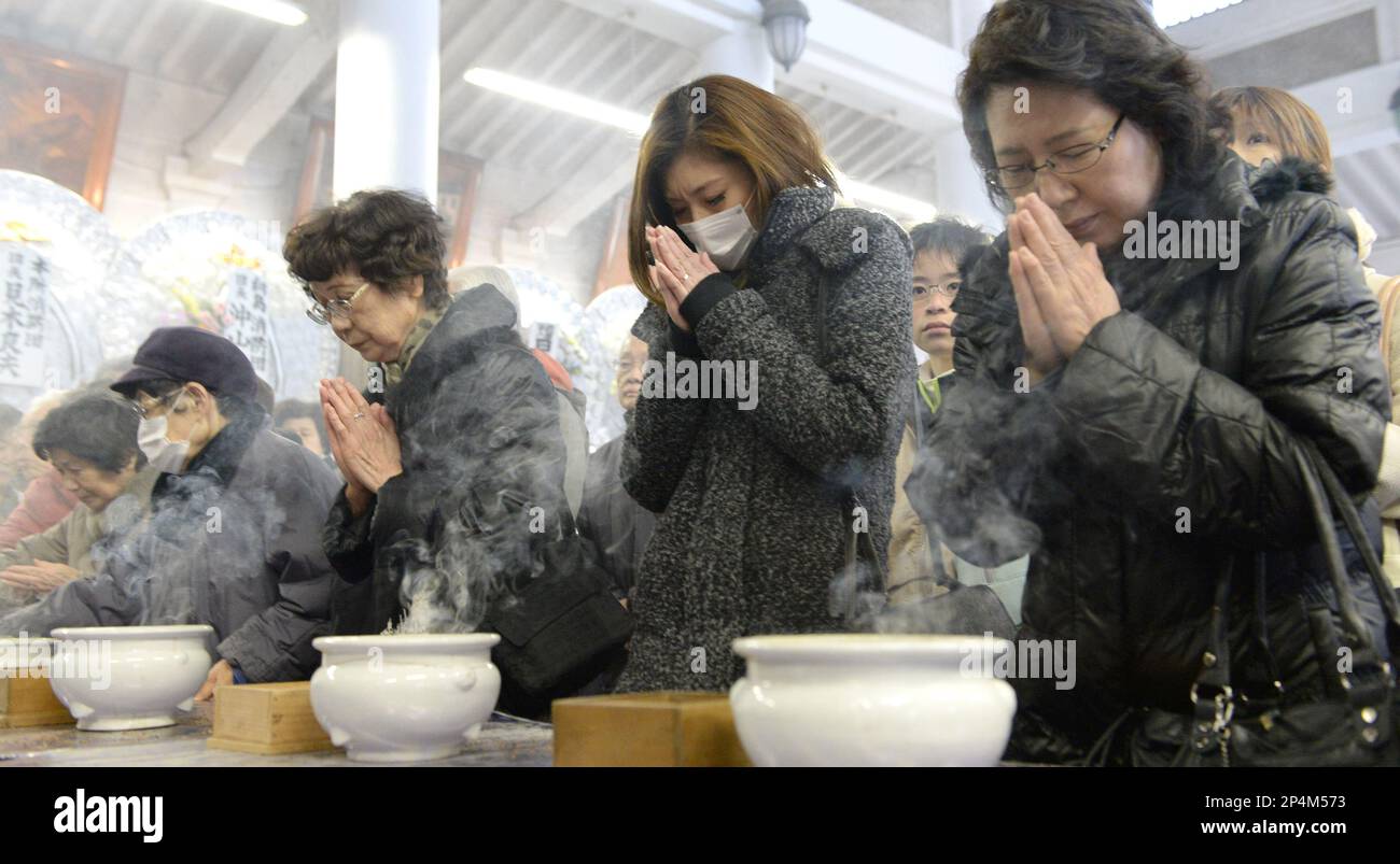Visitors offer incense at Tokyo Memorial Hall in Sumida Ward, Tokyo to ...