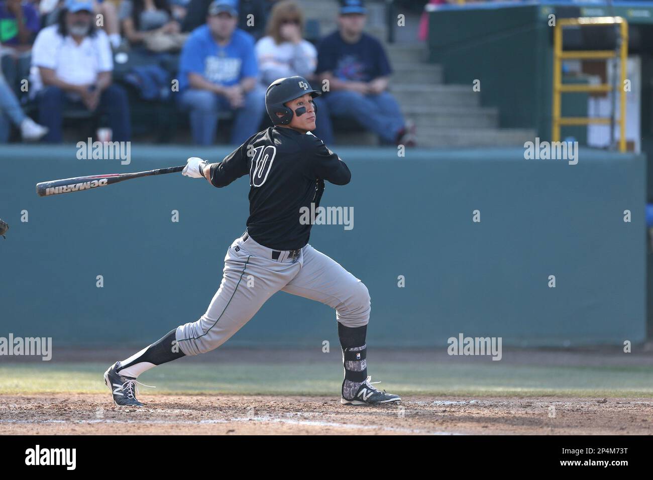 Nick Torres #10 of the Cal Poly Mustangs bats against the UCLA Bruins ...