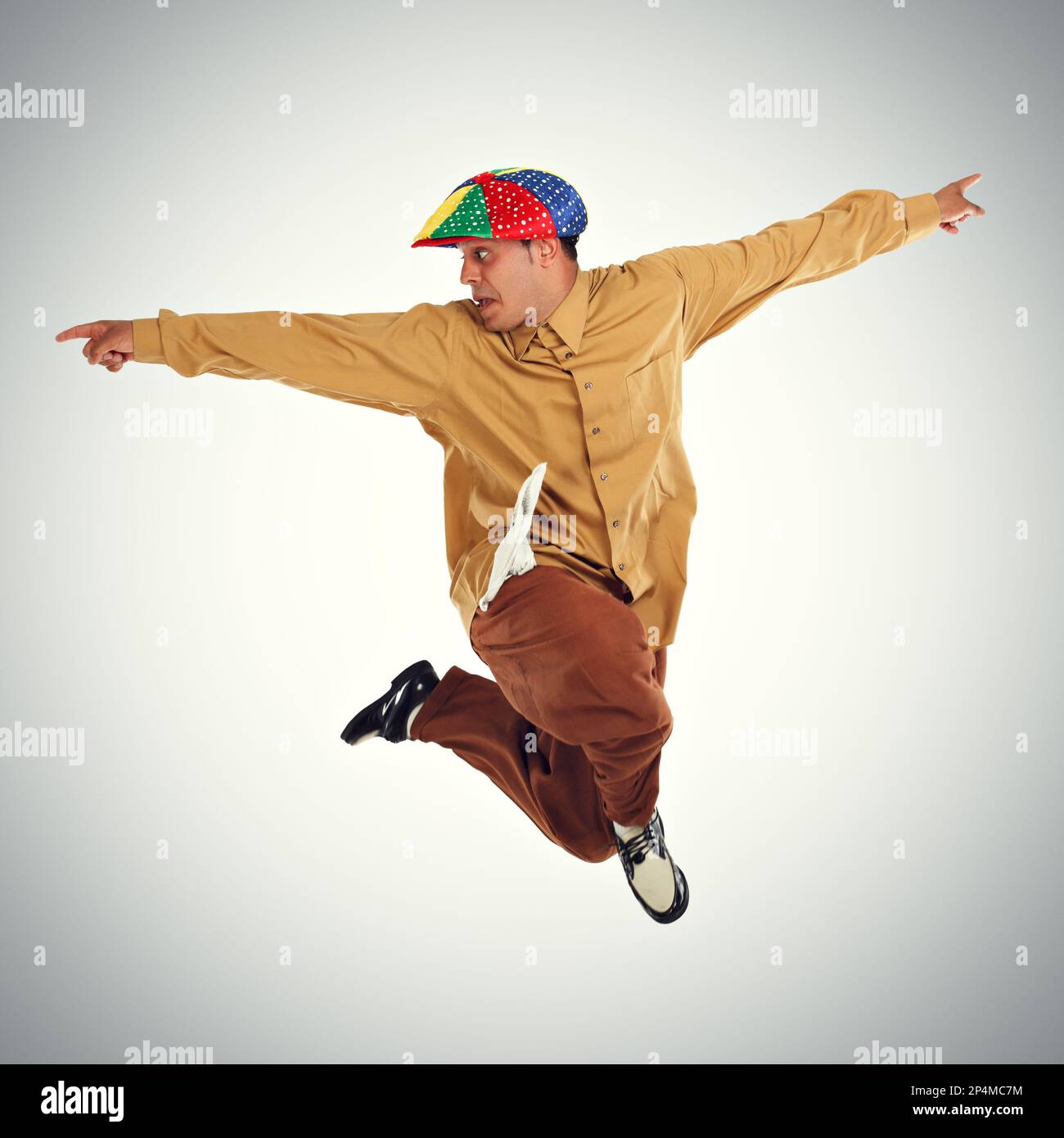 Breakdancer performer doing jump in studio Stock Photo - Alamy
