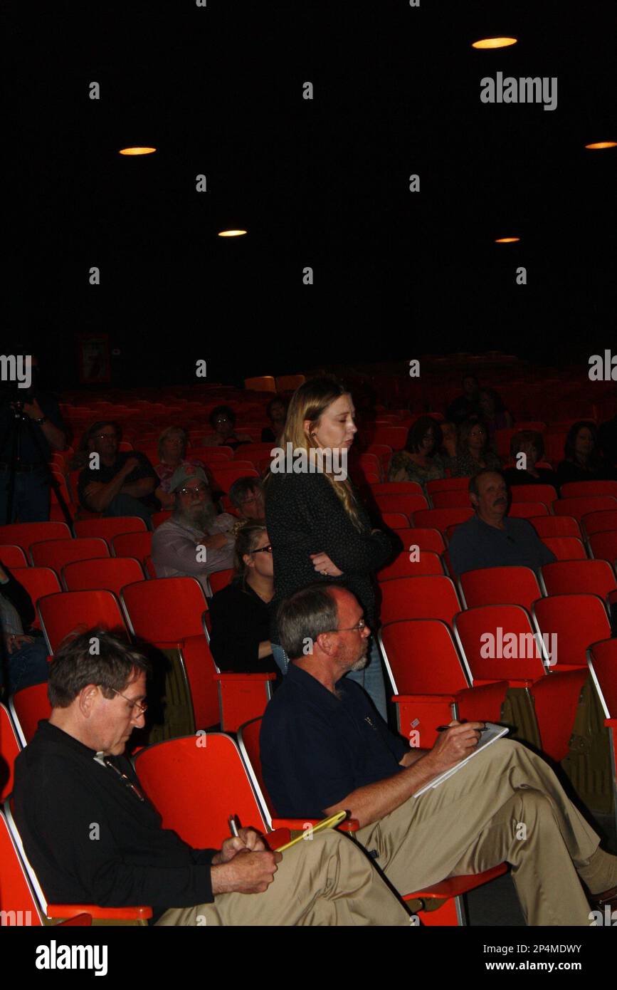 Carlsbad resident Cynthia Shaffer, standing center, tells of her ...