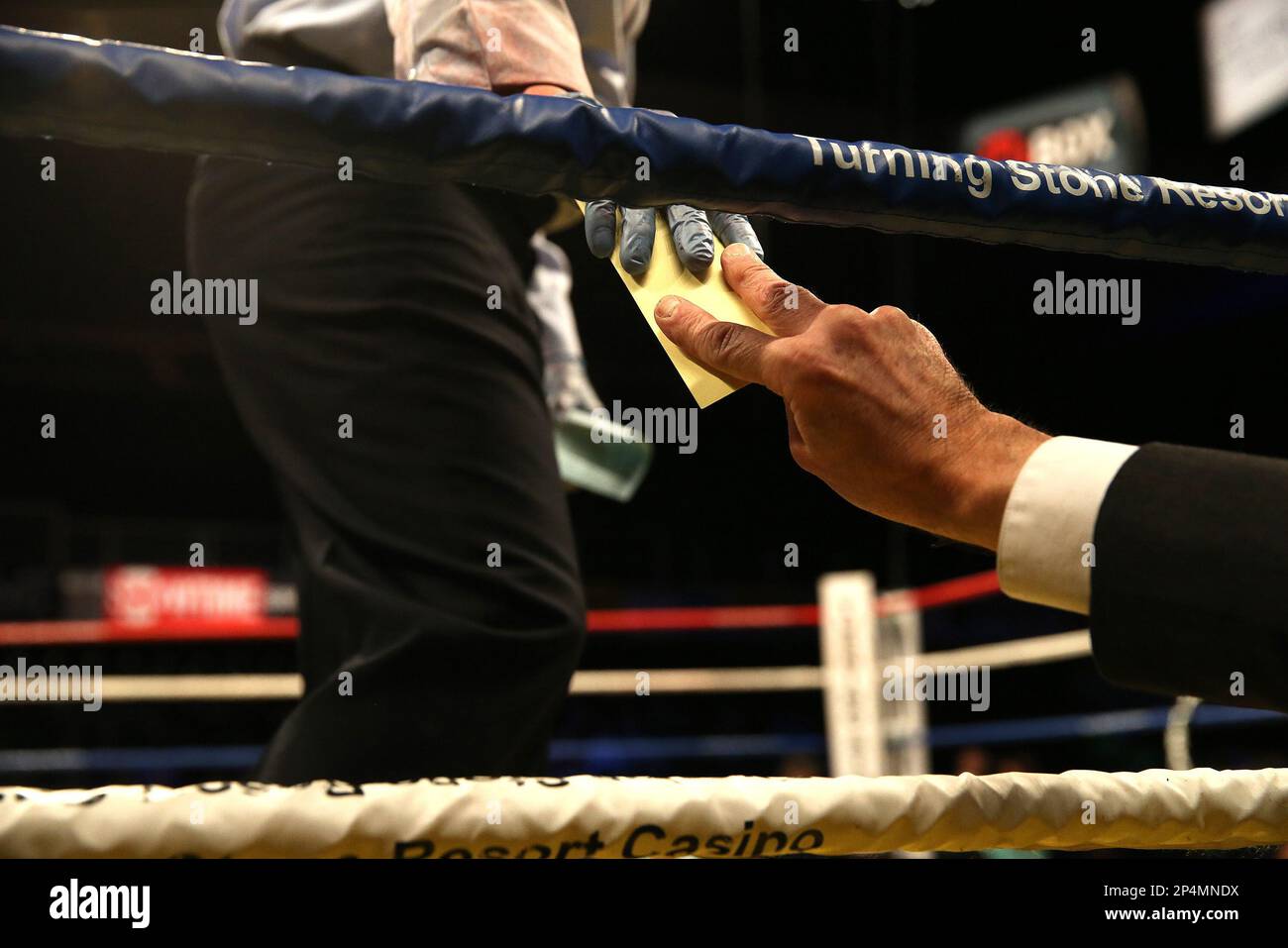 A judge hands his scorecard to the referee during Showtime Televisions ...