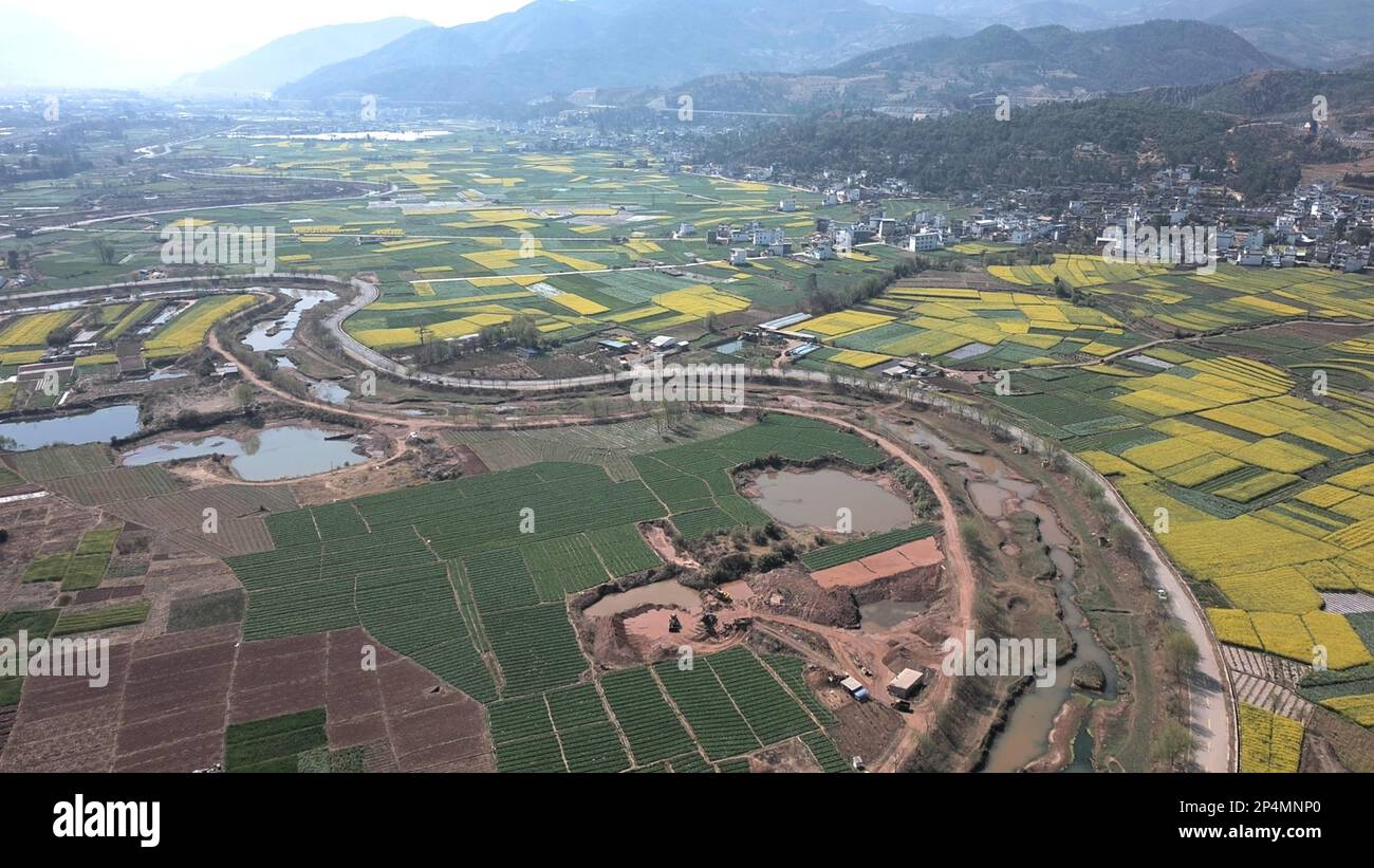 Aerial photo shows the beautiful field scenery of Xinyun Village ...