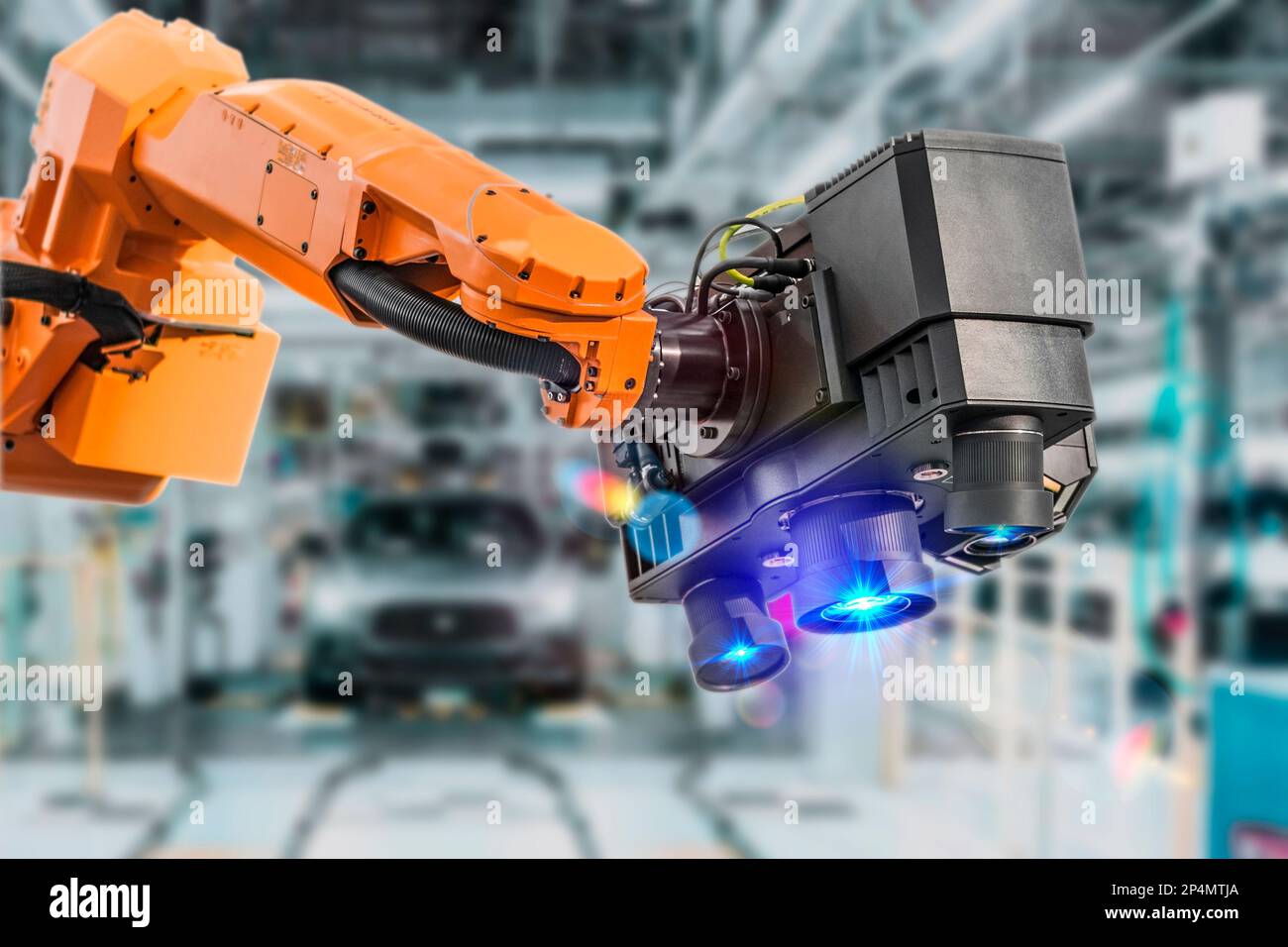 Industrial 3D laser scanner on robotic arm on background of car ...