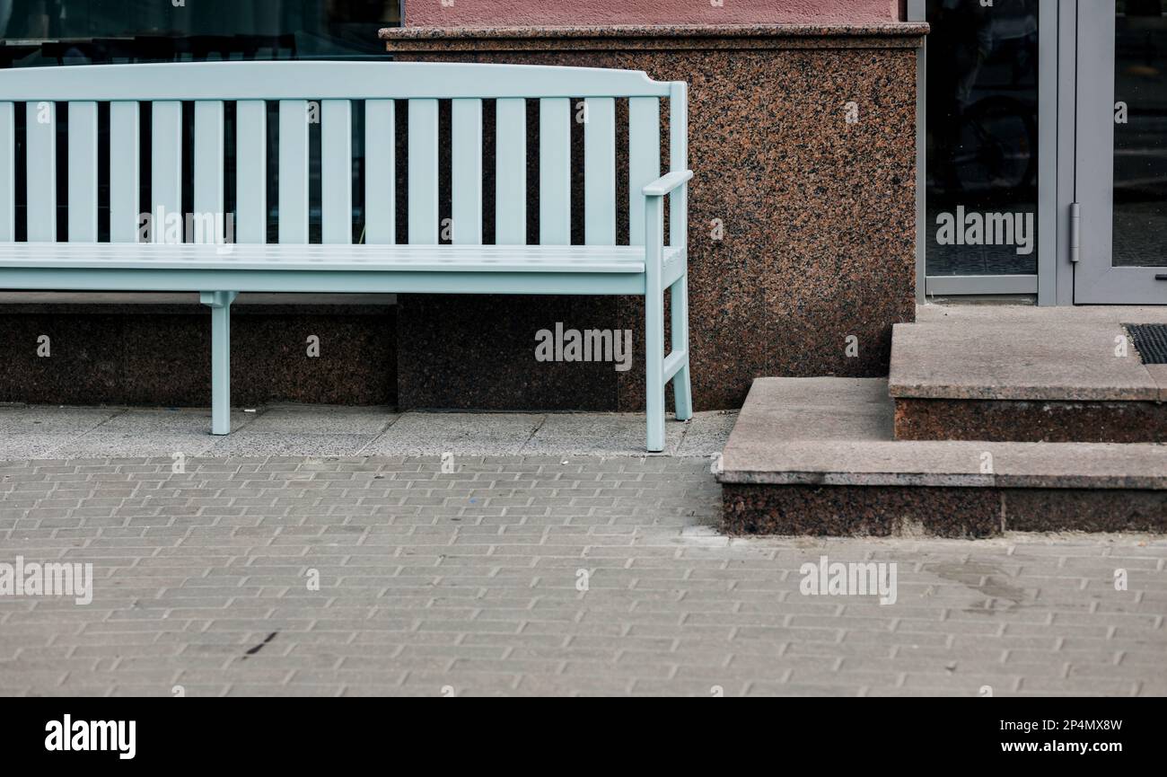 urban wooden cozy bench near the building Stock Photo - Alamy