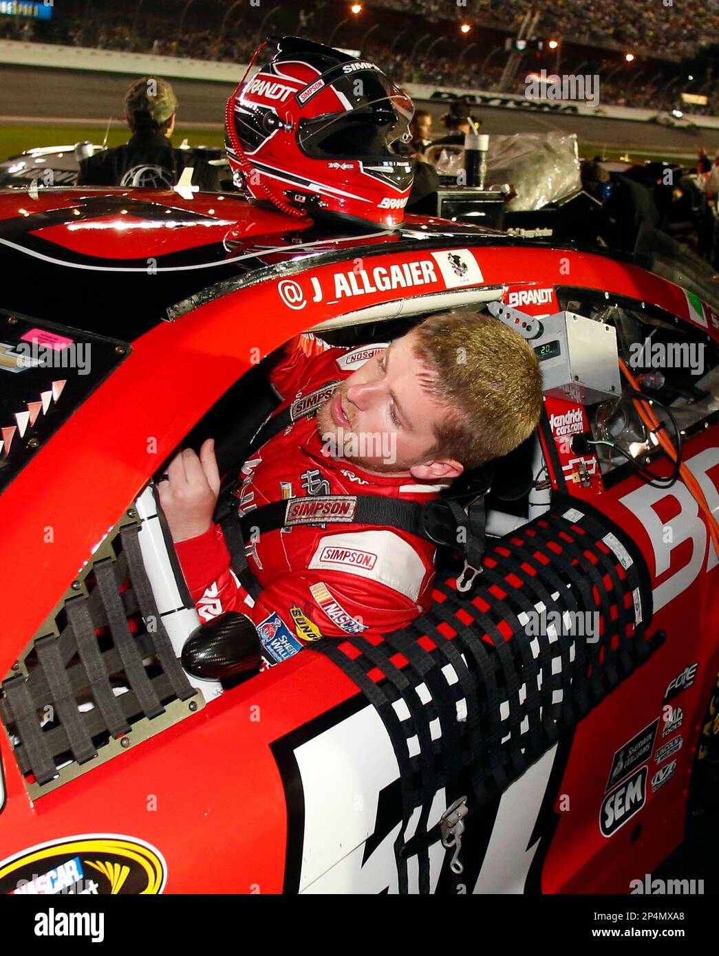 Driver AJ Allmendinger gets into his car during the Daytona 500 auto ...