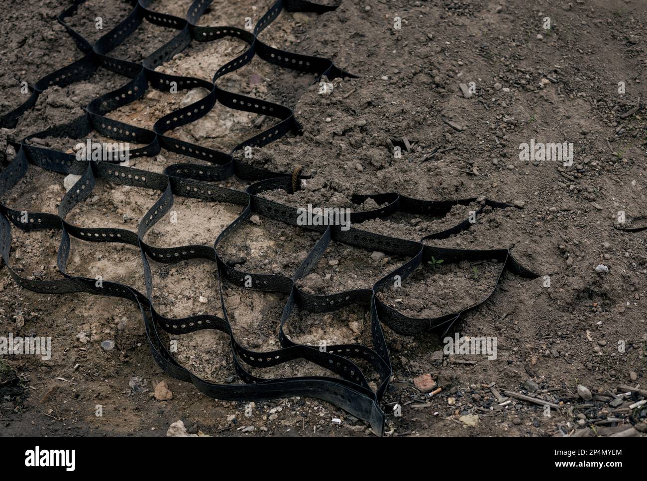 Polymer geogrid for filled with soil. stability of steep hill Stock ...