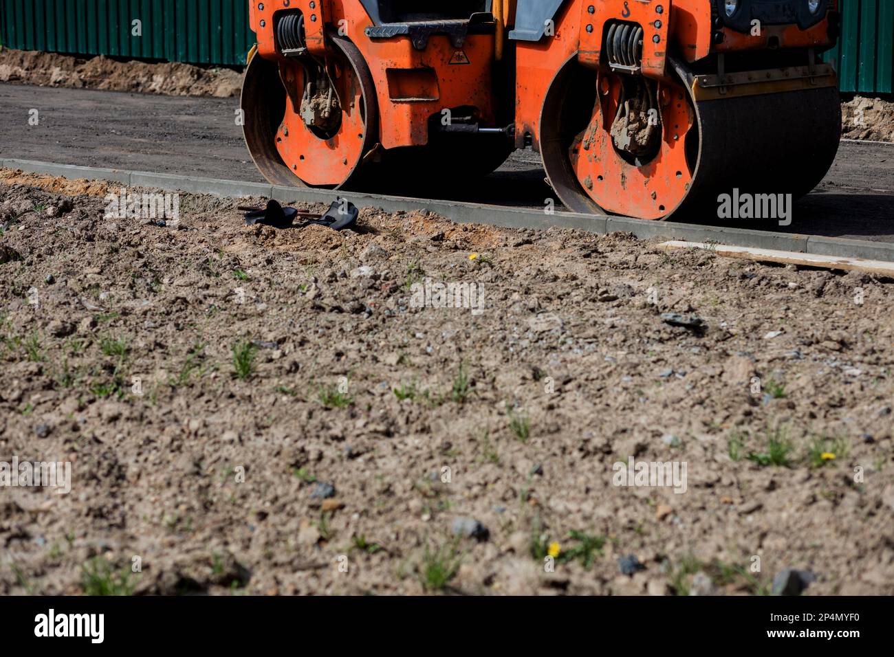 Laying of new modern asphalt. Asphalt laying equipment works on the ...