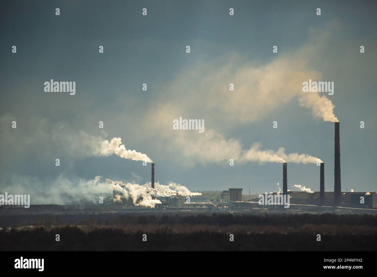 Air pollution from power plant chimneys. Pulp and mill factory Stock ...