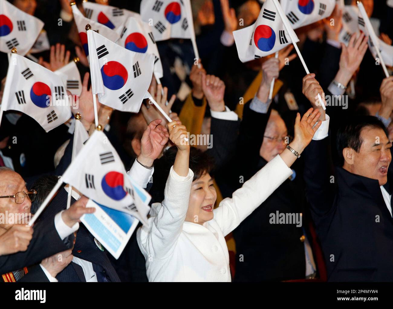 South Korean President Park Geun-hye, center, cheers with her national ...