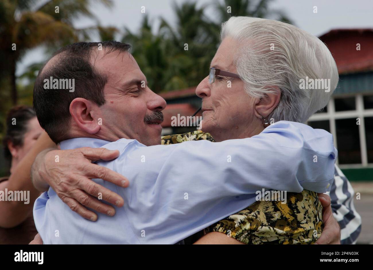 Fernando Gonzalez embraces his mother Magali Llort after his arrival at ...