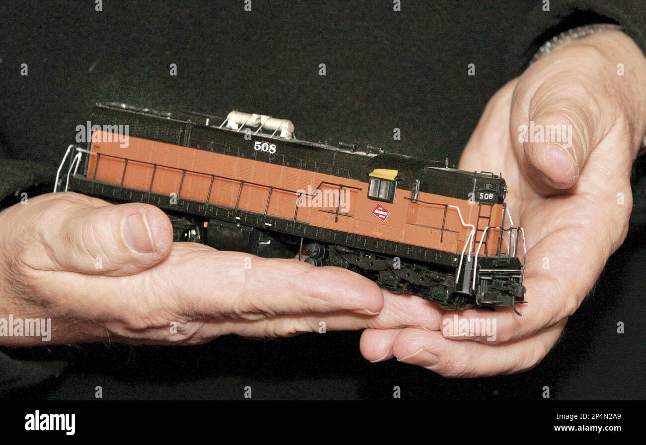 This photo taken on Feb. 12, 2014, Mike Bubrick holds a GM locomotive ...
