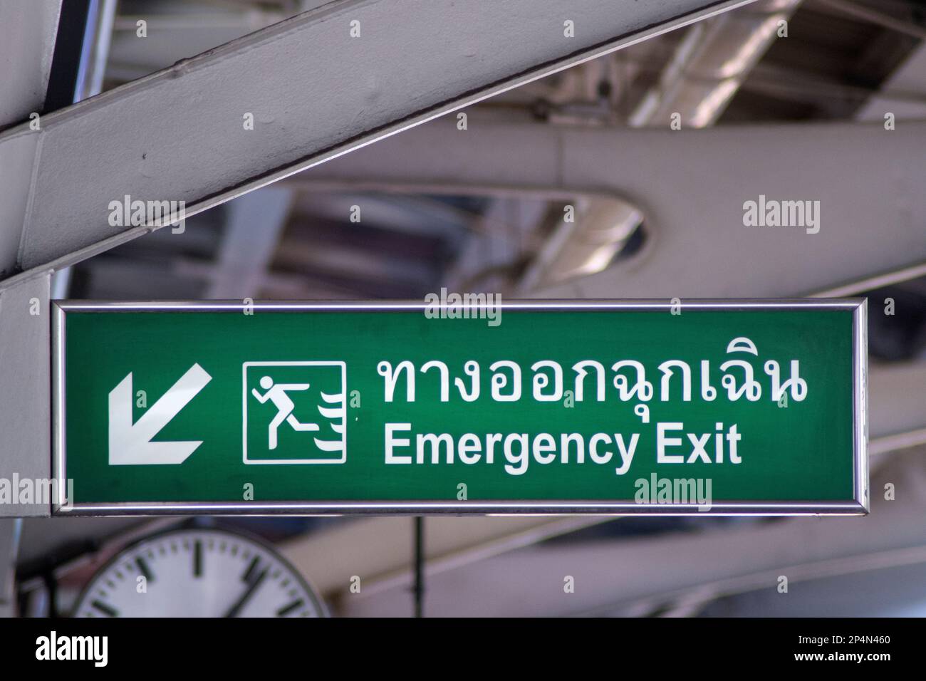 Large Emergency Exit sign with green light box is placed on BTS station ...